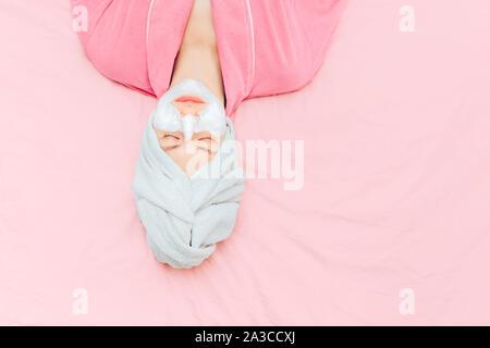 girl lying with a cosmetic mask on her face, close up Stock Photo - Alamy