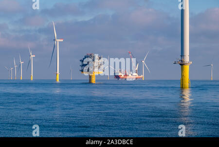 Some of the 175 turbines and one of the two offshore substations on the ...