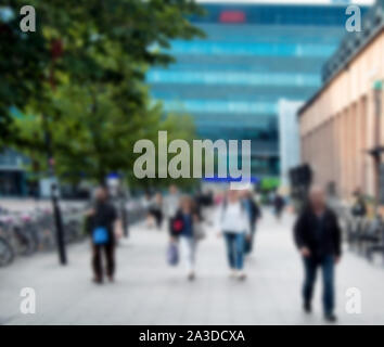 People are strong blurred anonymous. Business quarter with bulk of ...