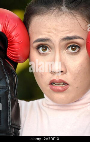 Female boxer wearing boxing gloves Stock Photo - Alamy