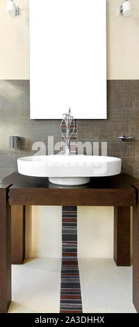Front view of modern wash basin with wooden stand Stock Photo - Alamy