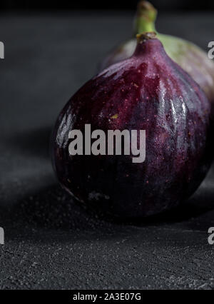 fresh figs close-up photo on black background. dark moody photo Stock ...