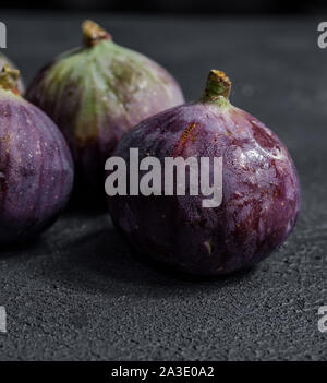 fresh figs close-up photo on black background. dark moody photo Stock ...