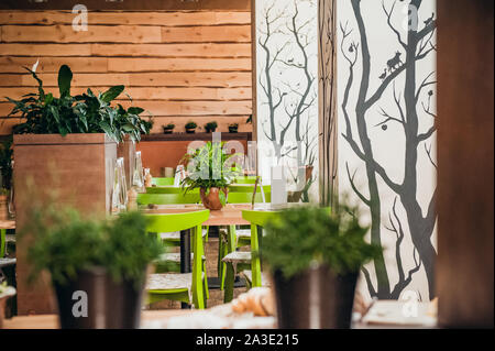 Bright cafe interior design concept in ecological natural style. Wooden ...