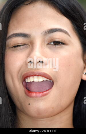 A Winking Pretty Minority Female Stock Photo - Alamy