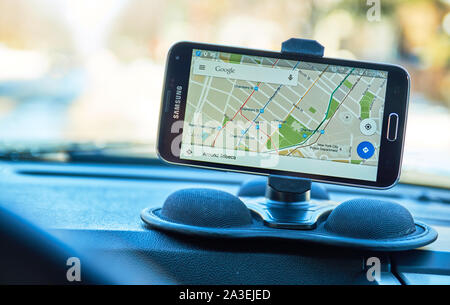 application,using google maps on a smartphone in a car. semarang, 13 ...