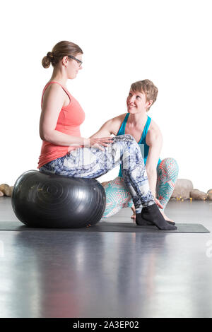 Personal trainer coaching a woman client Stock Photo - Alamy