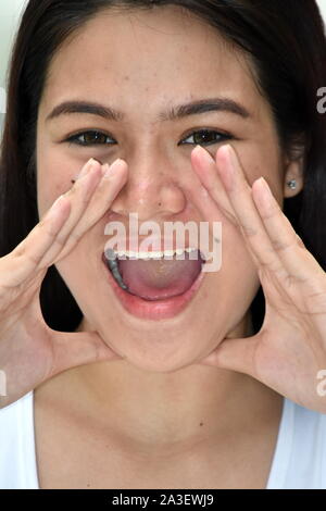 A Beautiful Minority Female Yelling Stock Photo - Alamy
