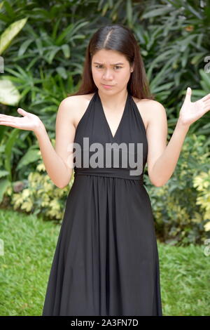 An Undecided Youthful Filipina Woman Stock Photo - Alamy