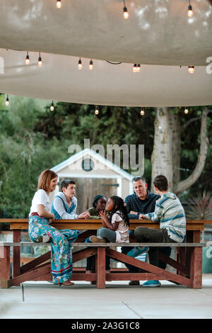 happy teen girl under pink umbrella in autumn weather isolated on white ...
