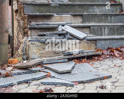 Structural damage to a staircase at the entrance to the house with ...