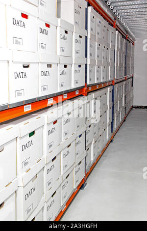 Long rack with data boxes in warehouse Stock Photo - Alamy