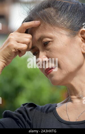 Minority Female Senior Making A Decision Stock Photo - Alamy