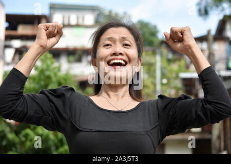 A Laughing Older Filipina Female Senior Stock Photo - Alamy