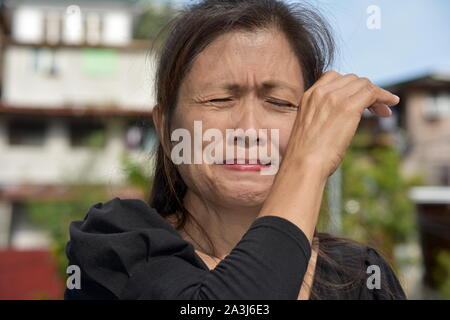A Crying Filipina Female Stock Photo - Alamy