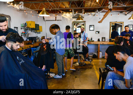 Busy barbers shop Stock Photo - Alamy