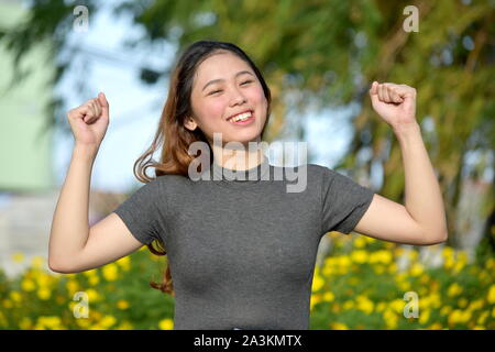 A Young Filipina Female And Muscles Stock Photo - Alamy