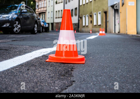 red plastic pylon barrier line on the street, modern security diversity ...