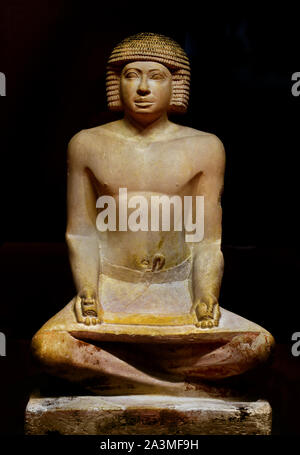 painted limestone statue of an Egyptian scribe seated cross-legged ...