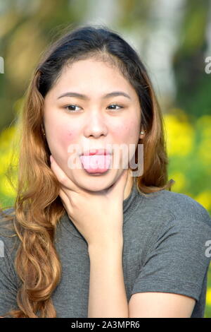 An Attractive Diverse Female Choking Stock Photo - Alamy