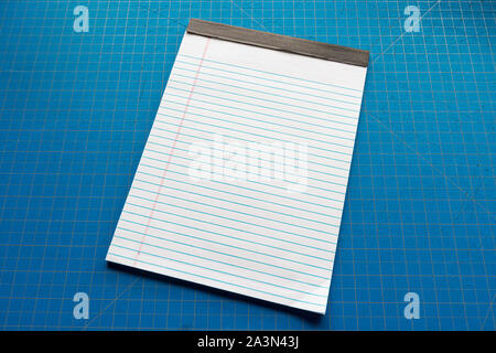 Horizontal shot of a Blank Legal Pad, black ink pen, and Cell Phone On ...