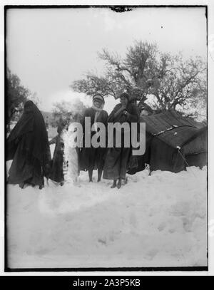 Snow in Jerusalem, 1921 Arab women in snow near tent. 1921, Jerusalem ...