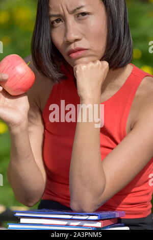 Teacher eating an apple Stock Photo - Alamy