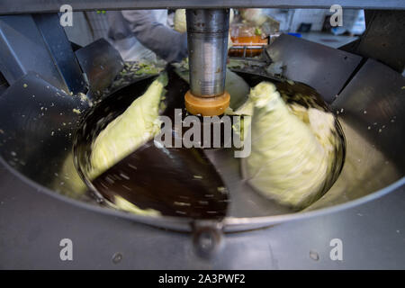 Filderstadt, Germany. 09th Oct, 2019. A worker layers planed pointed ...