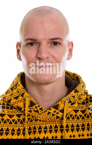 Studio shot of young handsome bald man standing with arms crossed Stock ...