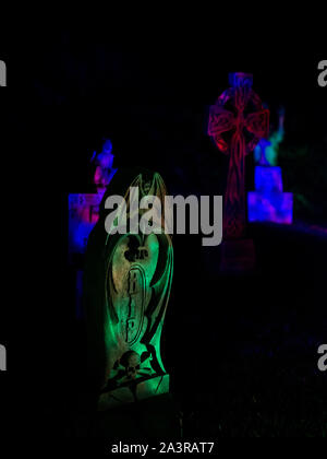 Neon Light Graveyard Scene with Tombstones and a Bucket of Guts Stock ...