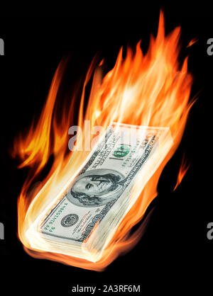 Dollar bills burning in flames Stock Photo - Alamy