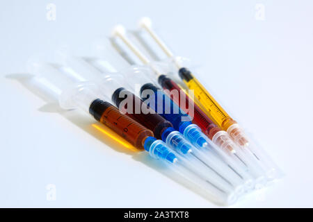 Medical syringes with colorful injections for cosmetology. Syringes ...