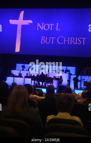 Christian believers gathering together to pray and worship in church ...