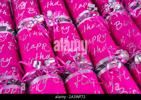 A studio shot of Happy Birthday Crackers Stock Photo - Alamy