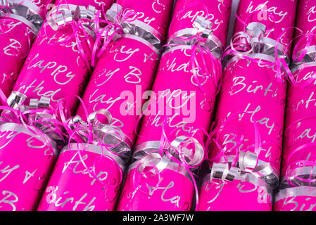 A studio shot of Happy Birthday Crackers Stock Photo - Alamy