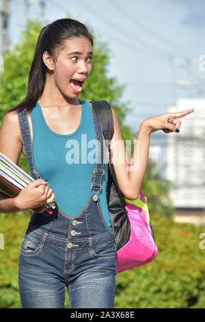 A Beautiful Filipina Female Student Pointing Stock Photo - Alamy