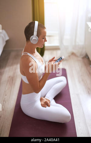Teen girl in headphones listen to music. Wireless headset device ...