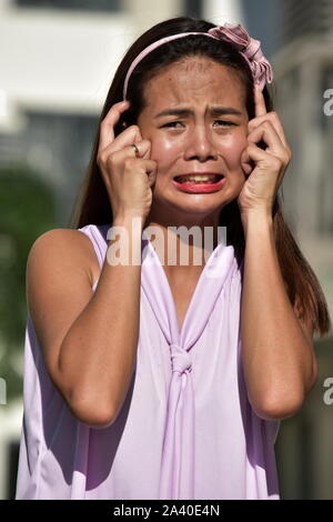 A Crying Youthful Filipina Female Stock Photo - Alamy
