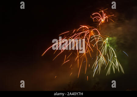 Beautiful multi-colored fireworks against the background of the night ...