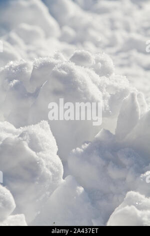 Snowflake on snowy background, close up Stock Photo - Alamy