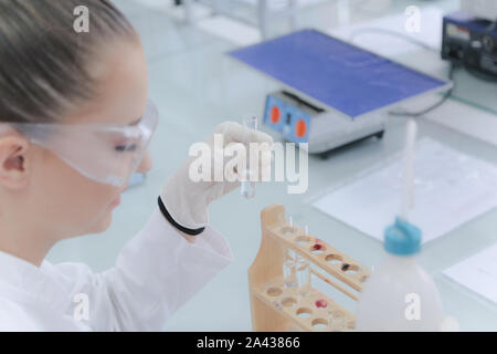 Young female scientist doing experiments in laboratory Stock Photo - Alamy