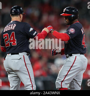Washington Nationals first base coach Davey Lopes watches the action ...