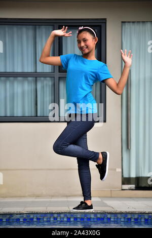 Female Having Fun Standing By Condo Stock Photo - Alamy