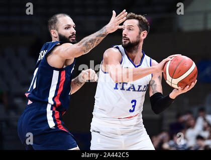 Evan Fournier of France, right, keeps the ball during semifinal match ...