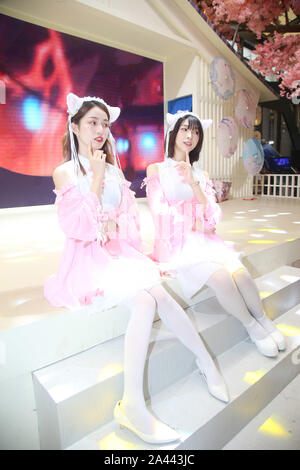Chinese showgirls pose during the 17th China Digital Entertainment Expo ...