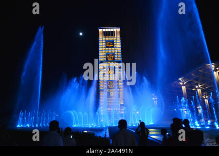 Water dances along as the music plays during a musical fountain light ...