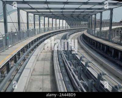 Chinese workers introduce the Light Rail Transit (LRT) system at the ...