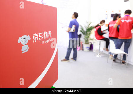 People visit the stand of JD Logistics of Chinese online retailer JD ...