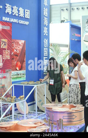 --FILE--People visit the stand of Hailiang Group during an expo in ...