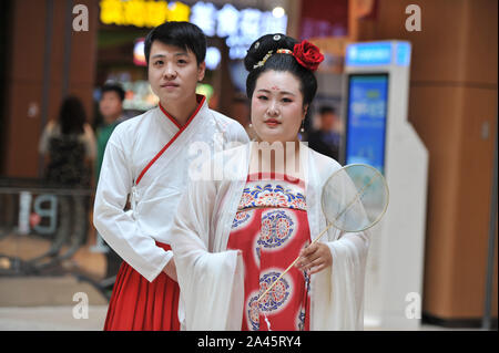Beauties dressing in ancient Chinese clothes prepare to demonstrate and ...